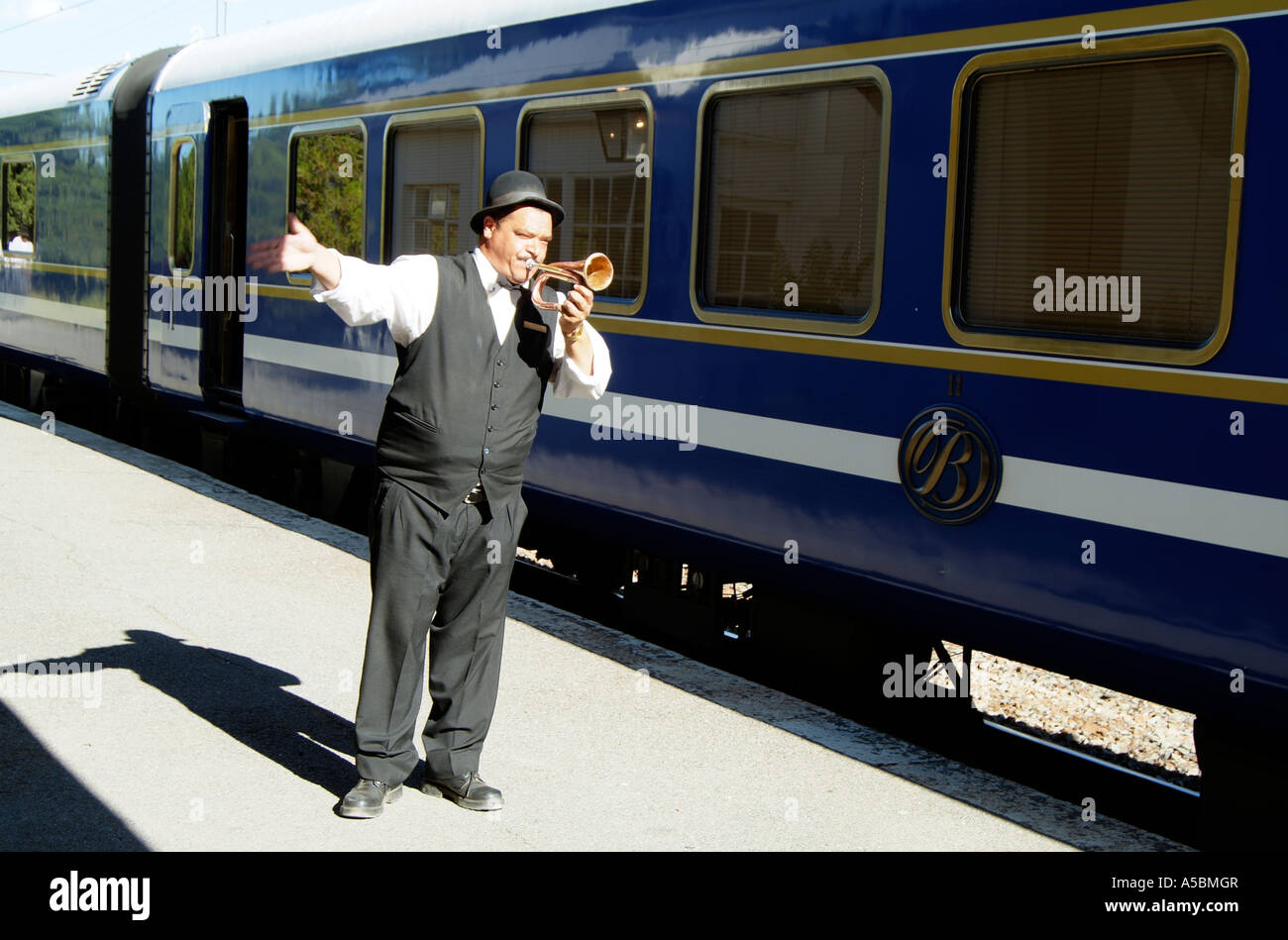 The Blue Train. Bugle playing porter greets the famous train at ...