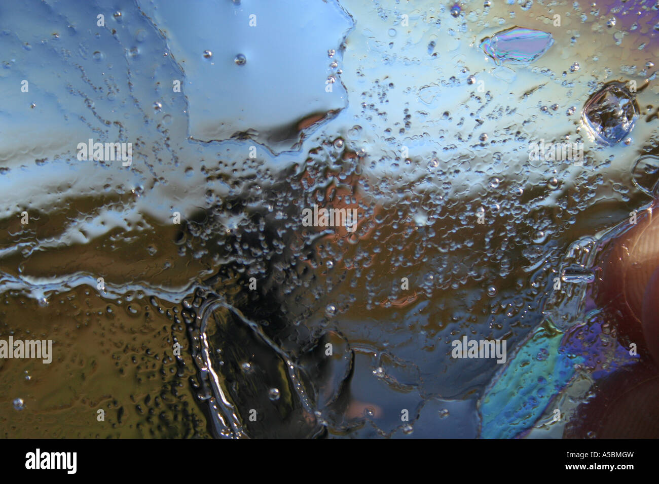 Human figure viewed through pane of ice Stock Photo - Alamy