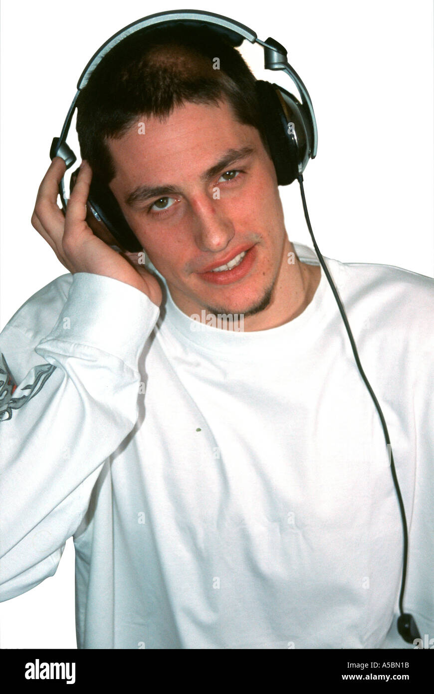 young man listening mp3 music on headphone Stock Photo - Alamy
