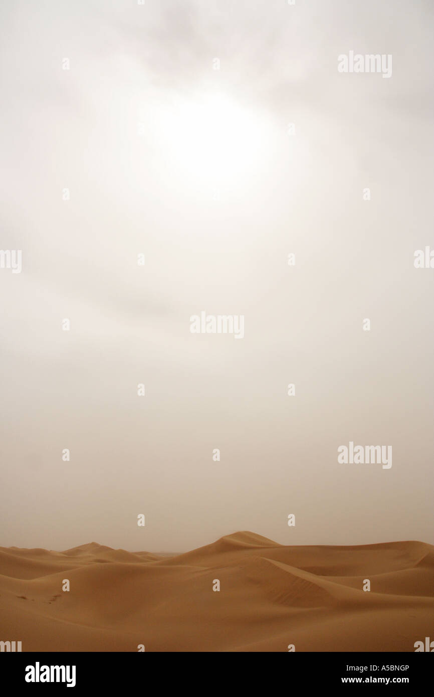 Sahara desert with sun breaking through a sandstorm Stock Photo - Alamy