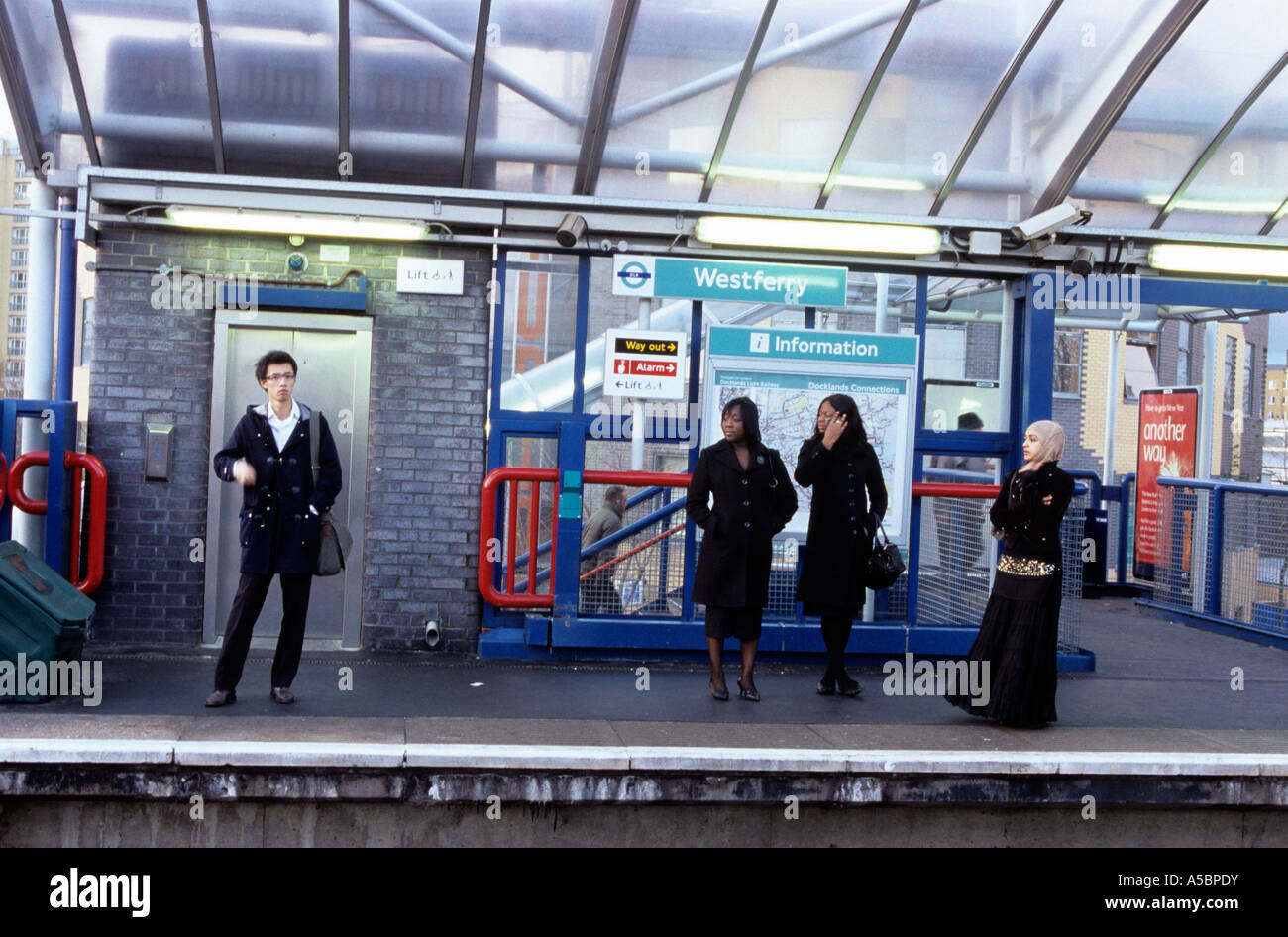 Passangers wait for the train at the Westferry station at Canary Wharf ...