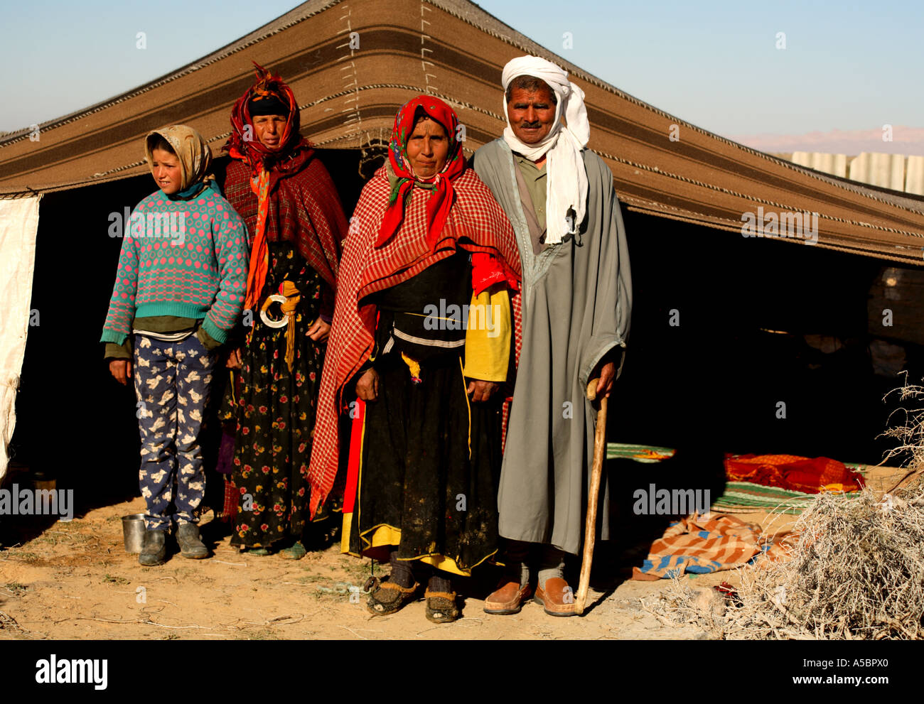 Horizontal portrait of local berber family outside their nomadic tent ...
