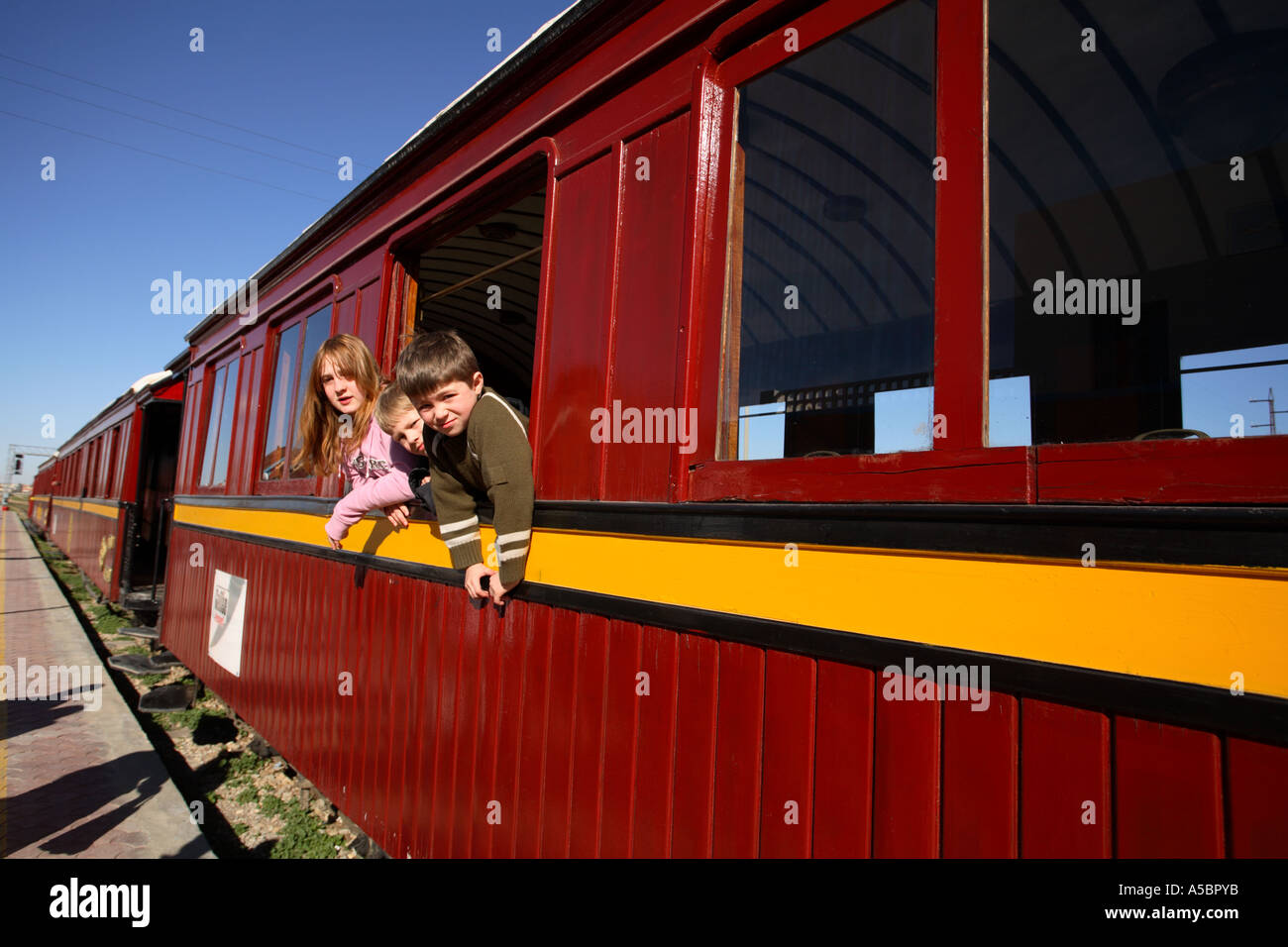 Horizontal portrait of caucasian child tourists on holiday looking out ...