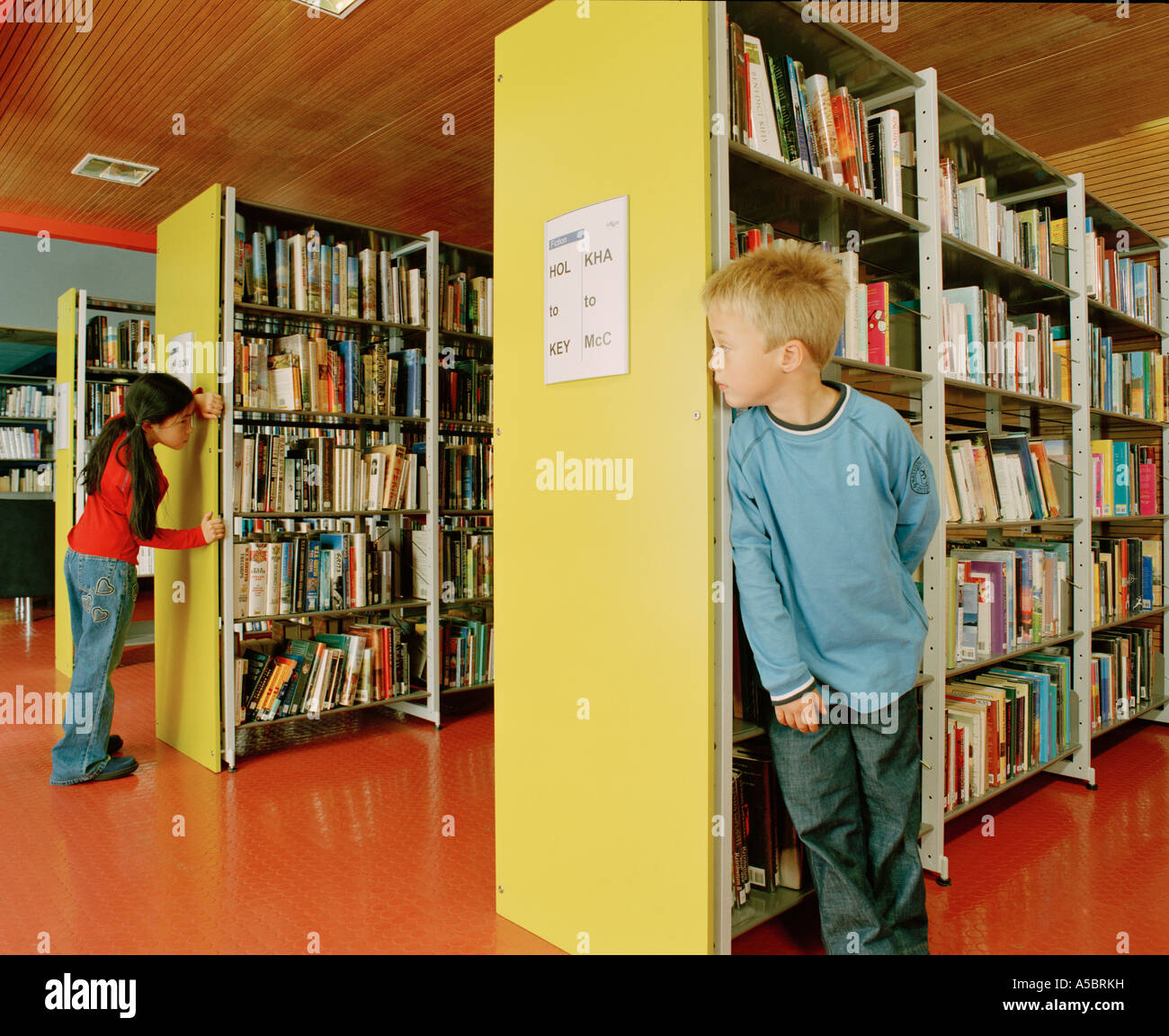 Boy girl play hide and seek in hi-res stock photography and images - Alamy