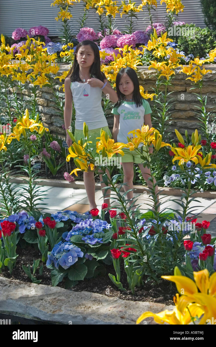Asian children age 7 and 11 posing for pictures. Marjorie McNeely ...