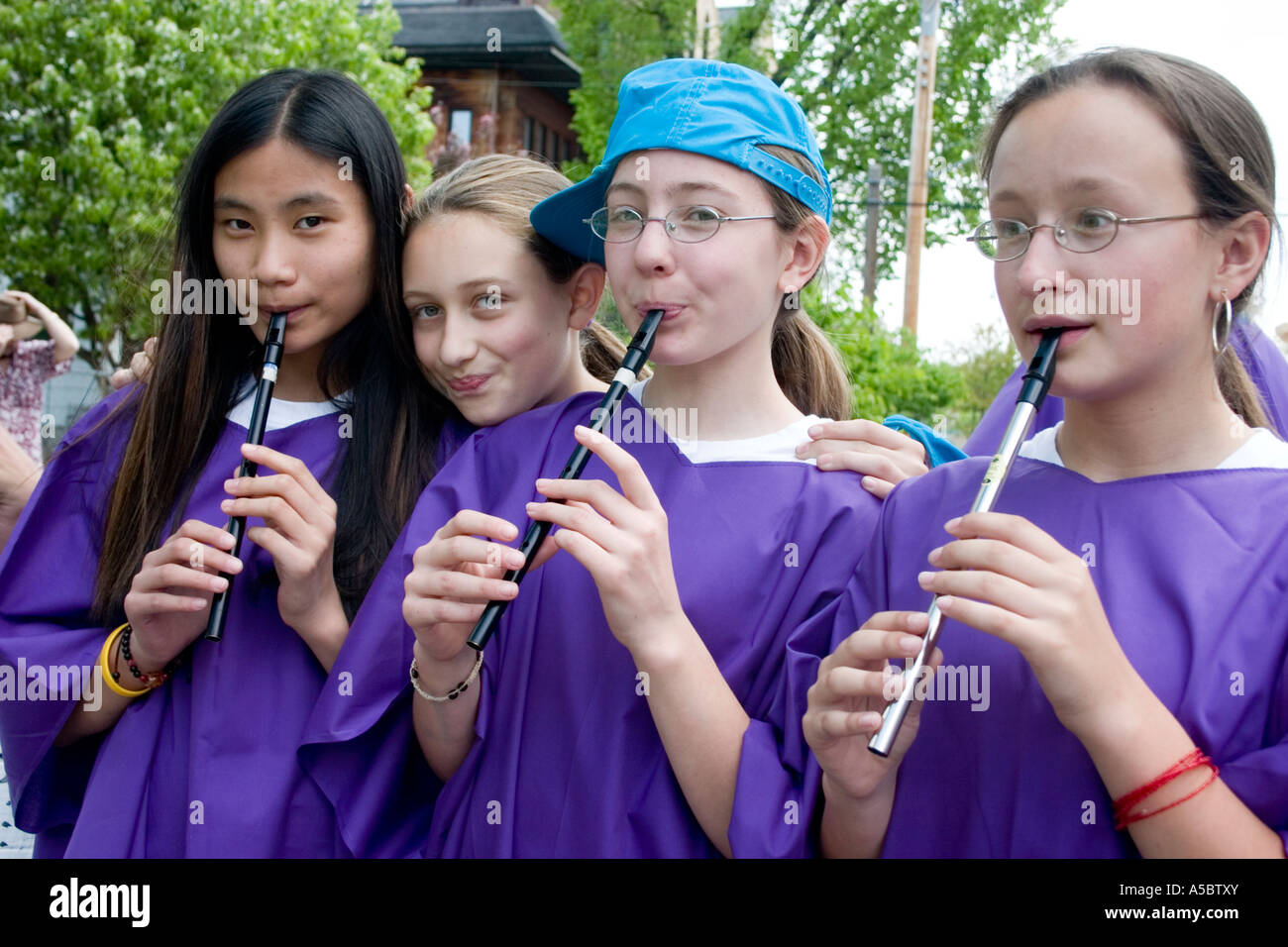 Multiracial group of teens playing recorders. In the Heart of the Beast ...