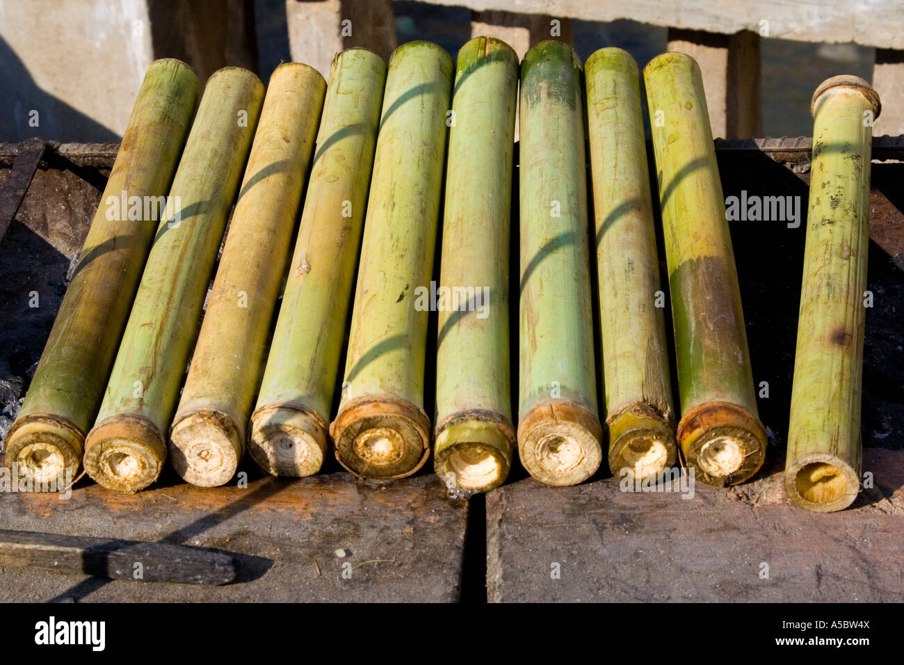 Bamboo Filled with Sticky Rice Roasting on the Grill Menghai Market ...