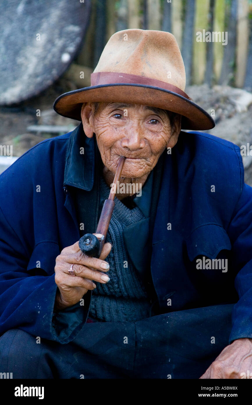 Ethnic akha man smoking his pipe hi-res stock photography and images ...
