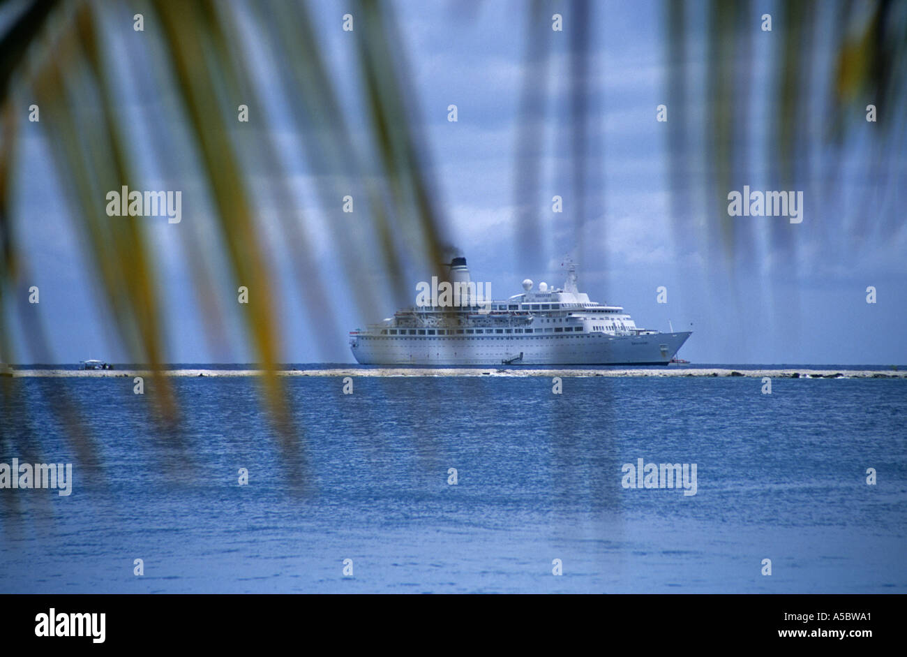 South Pacific Ocean cruise ship Discovery anchored off Rangiroa lagoon ...