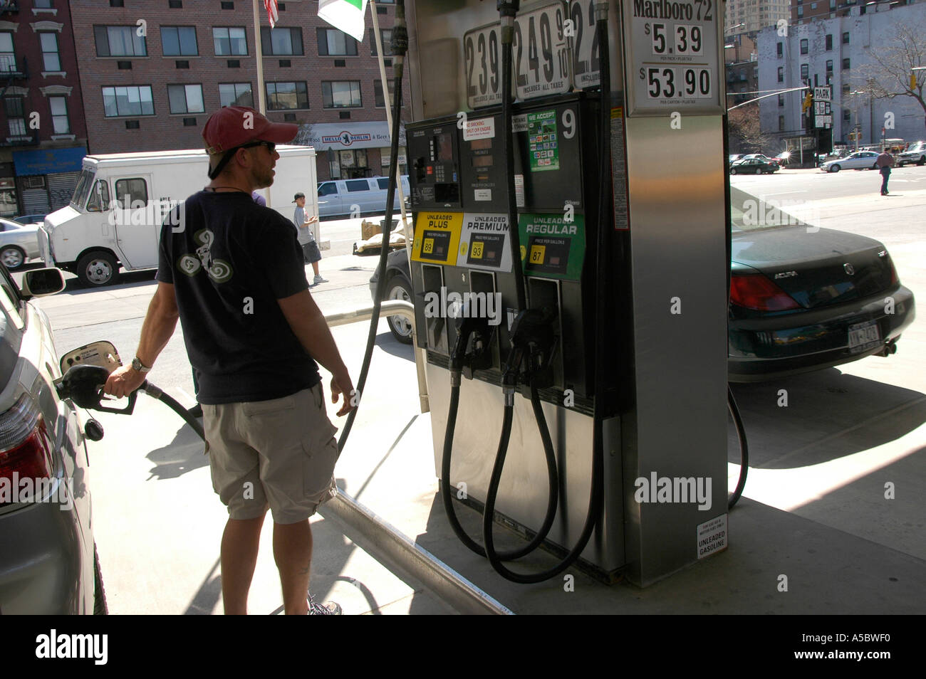 Drivers gas up their cars at a Hess gasoline station Stock Photo - Alamy
