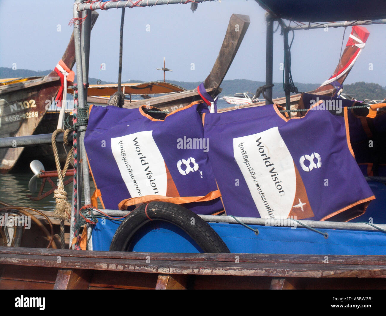 World Vision aid organization life jackets on tourist longtail boat Ao ...