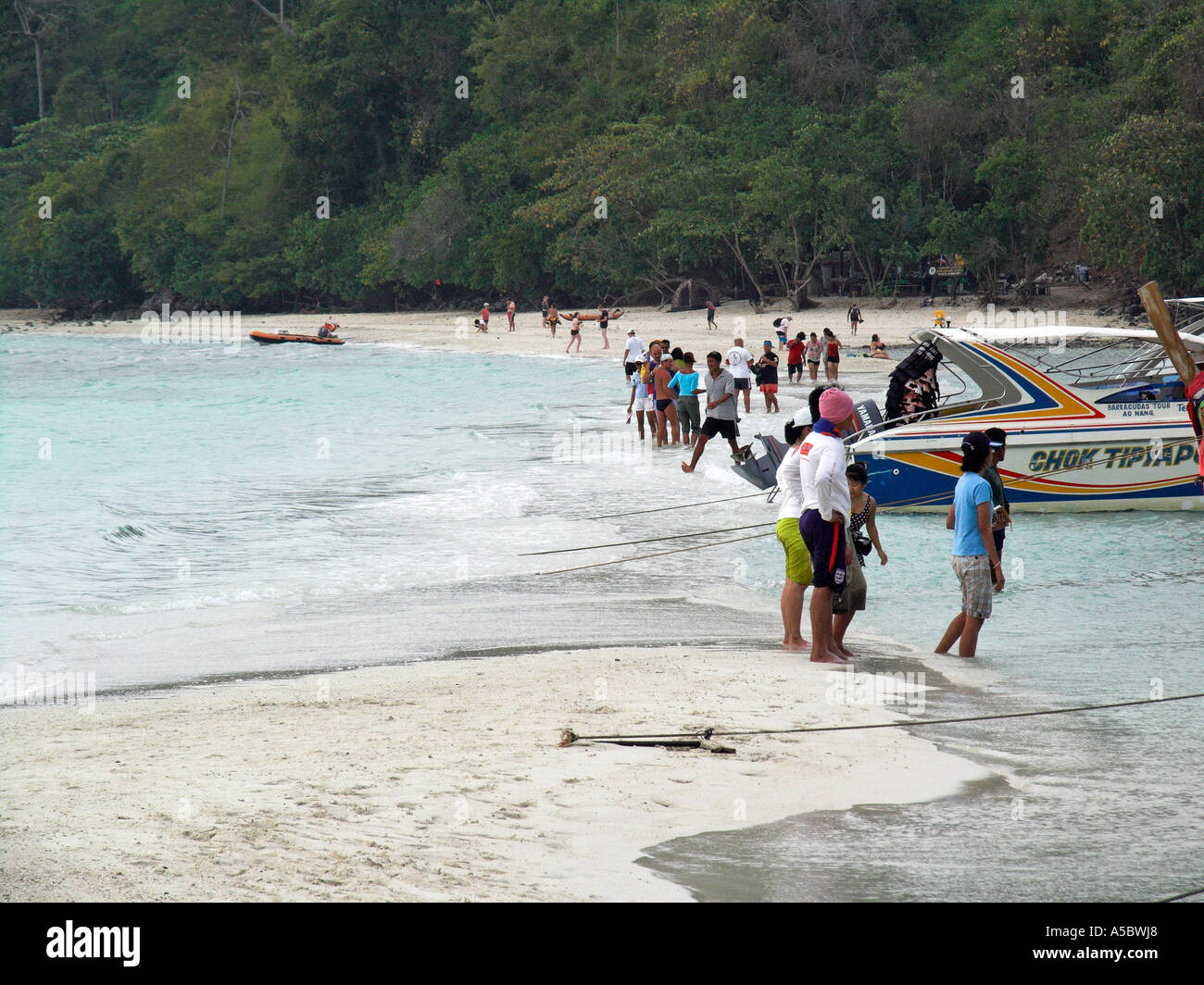 Day trip boats arrive and park at low tide sand bar joining Ko Tup and ...