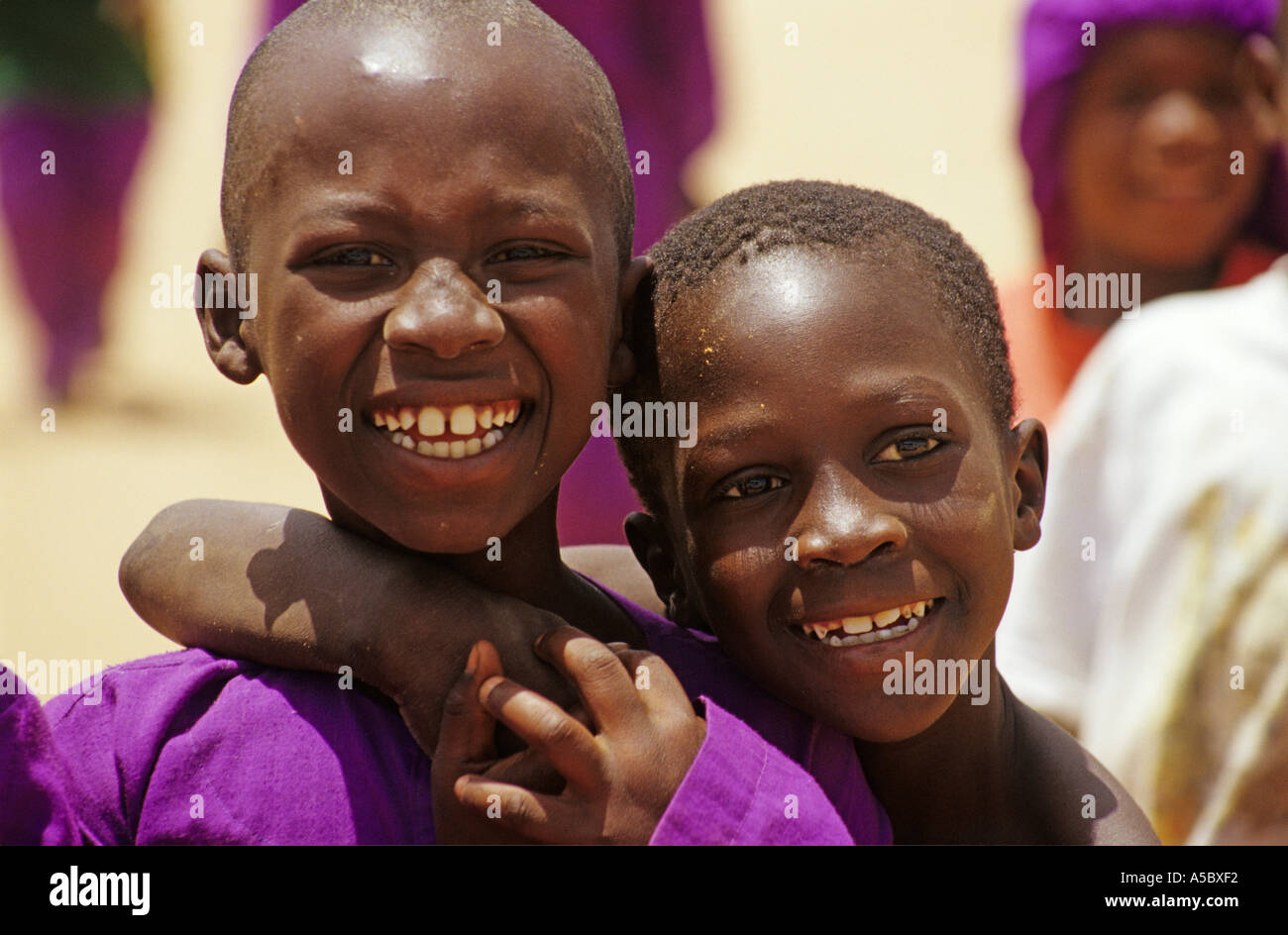 African boys hug hi-res stock photography and images - Alamy