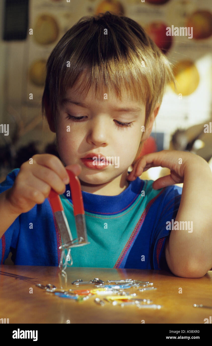 Child holding magnet hi-res stock photography and images - Alamy