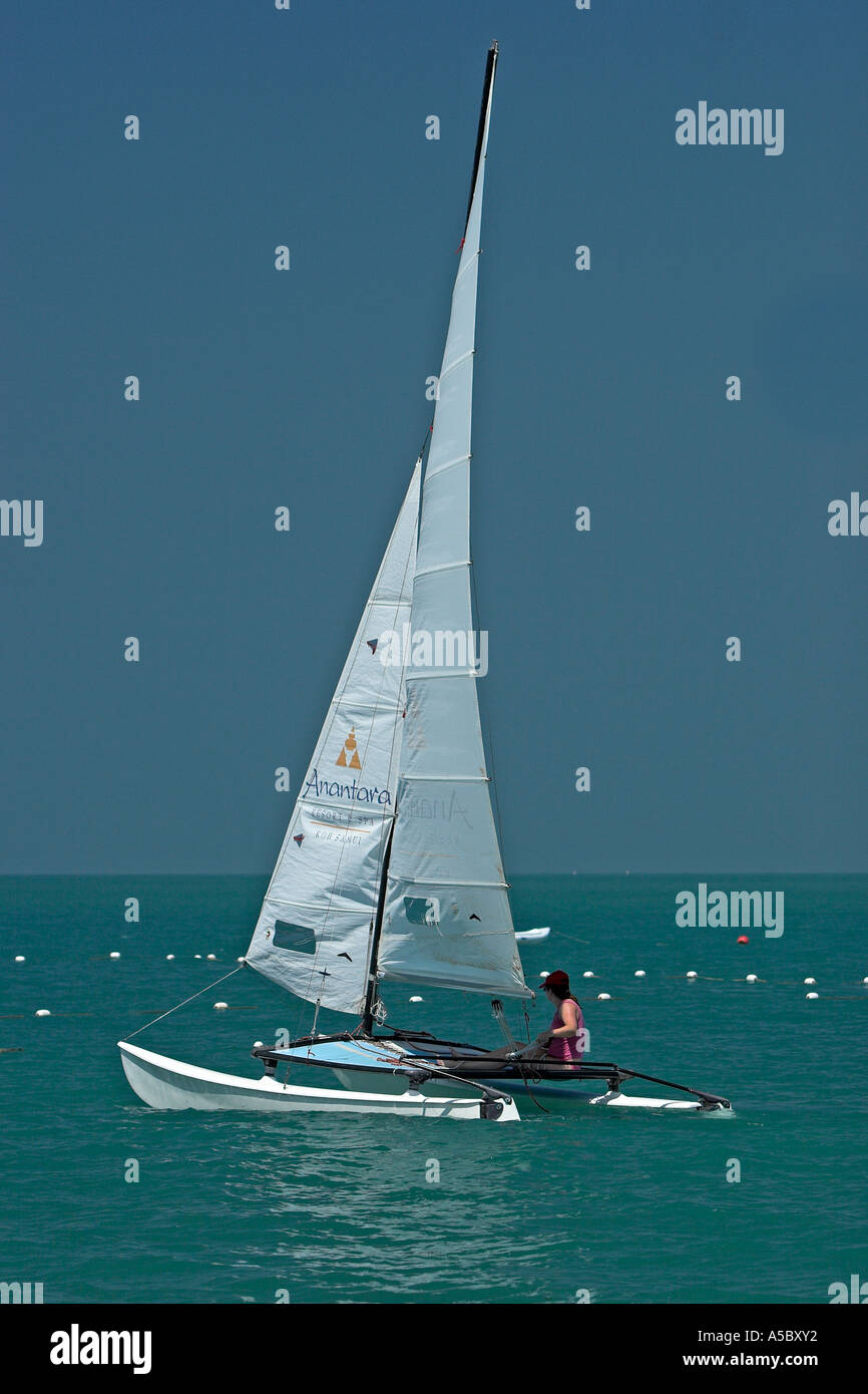 Young woman sails resort catamaran off Bo Phut Beach north Ko Samui ...