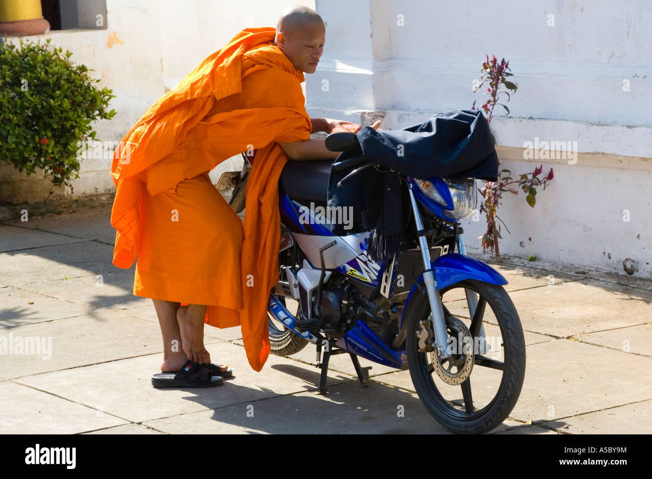 Monk Admiring a New Motorcycle Luang Prabang Laos Stock Photo - Alamy