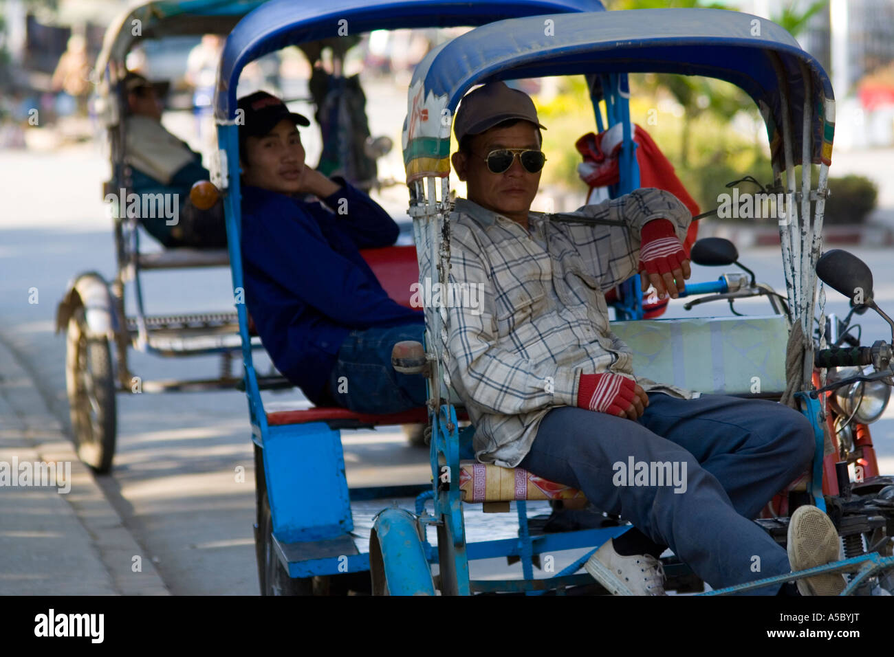 Rickshaw Drivers Waiting for a Fare Luang Prabang Laos Stock Photo - Alamy
