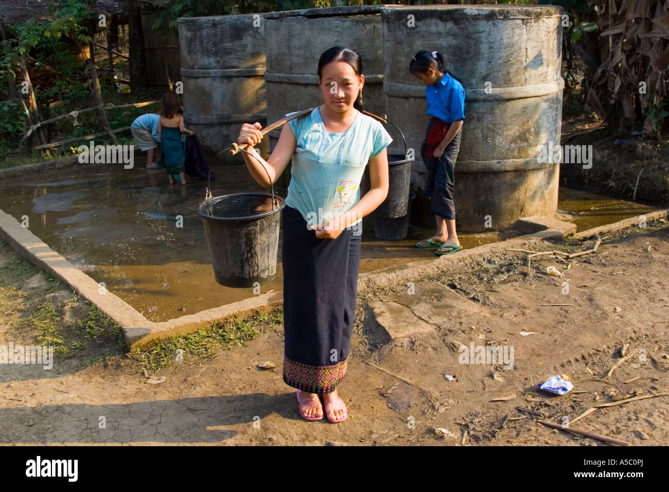 Woman hauling water hi-res stock photography and images - Alamy