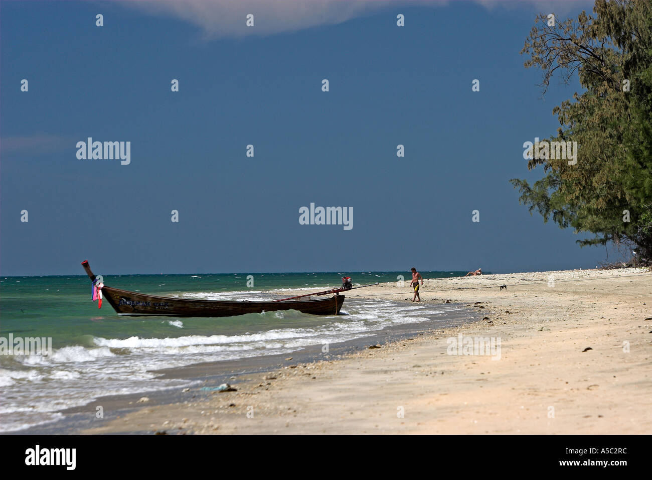 Traditional longtail boat at beach Ko Jum island Thailand Stock Photo ...