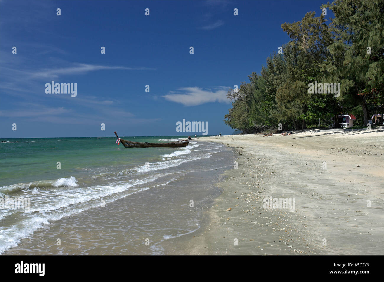 Traditional longtail boat in surf Ko Jum island Thailand Stock Photo ...