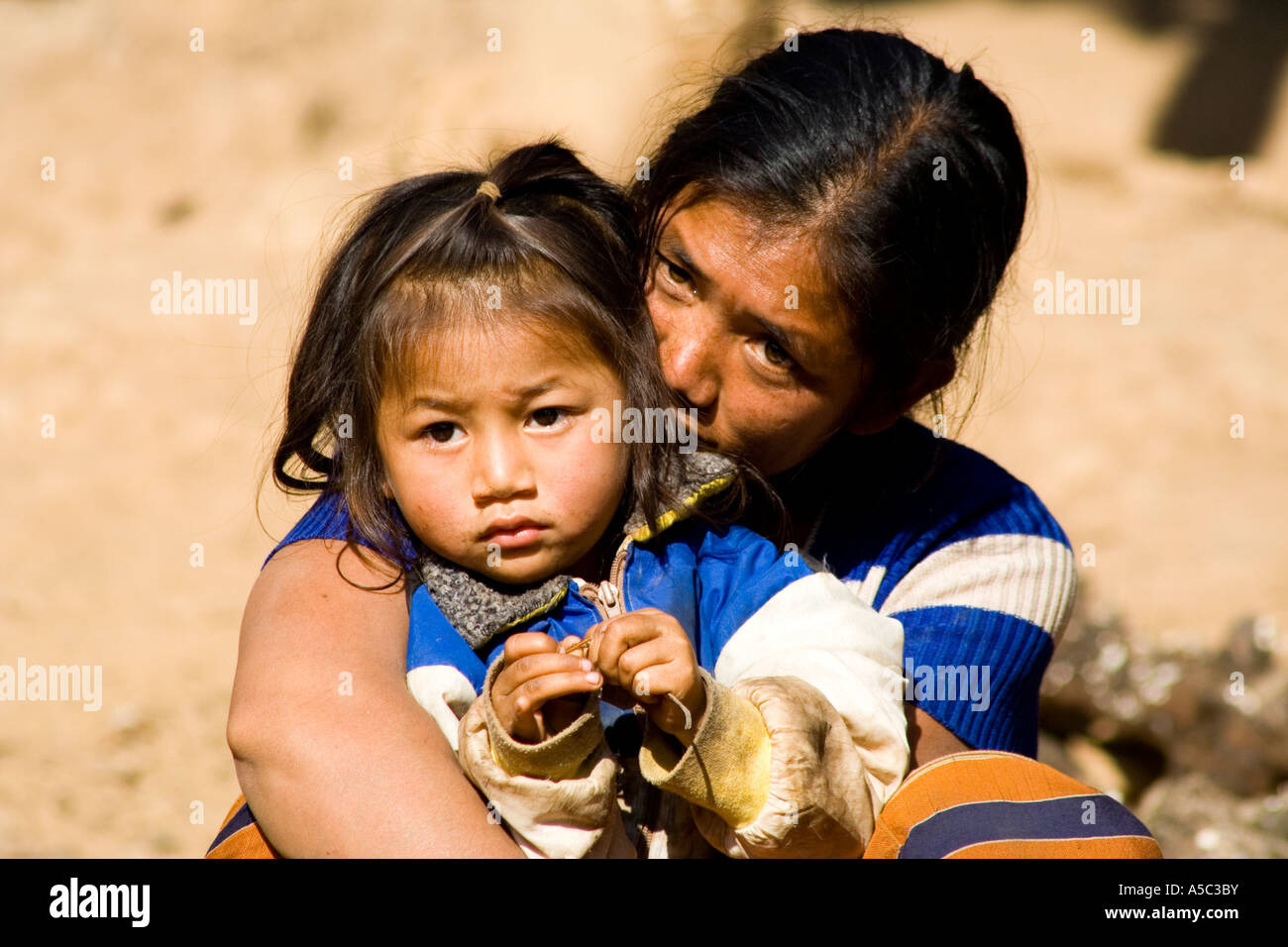 Young Daughter in Mother Lap Udomxai or Muang Xai Laos Stock Photo - Alamy