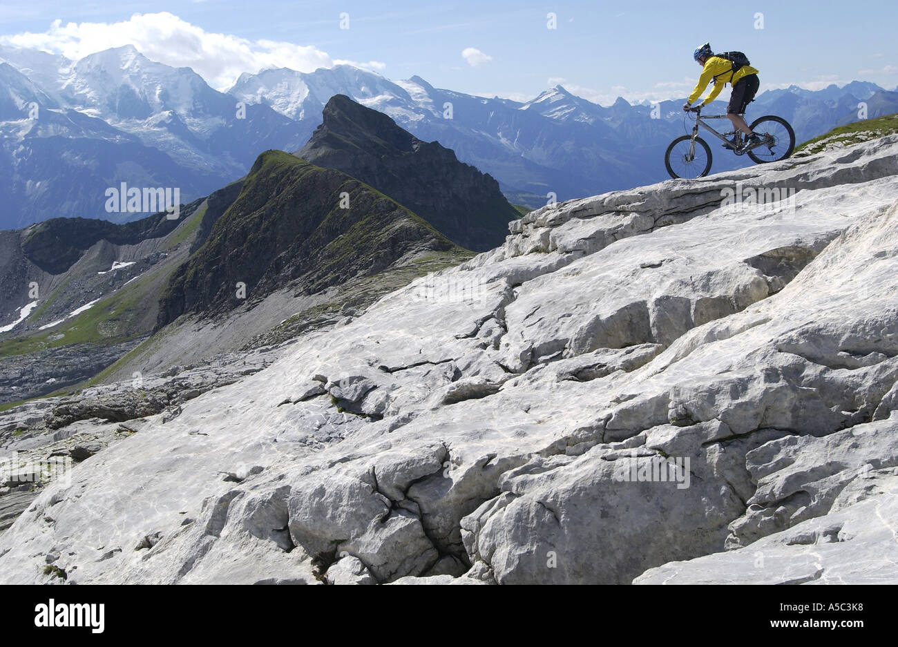 Mountain biking in the Swiss and French Alps Stock Photo - Alamy