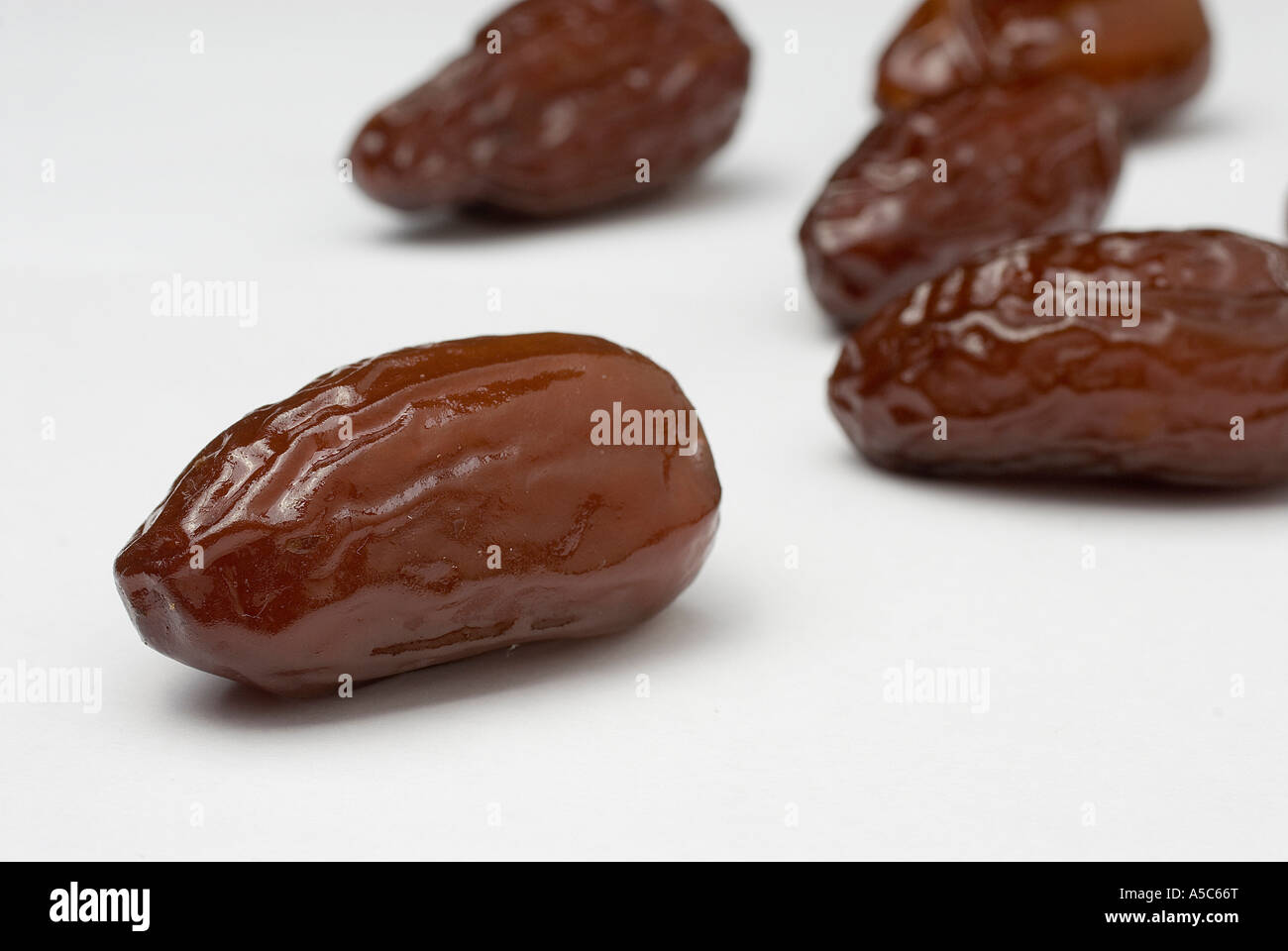 Dates on white background Stock Photo - Alamy