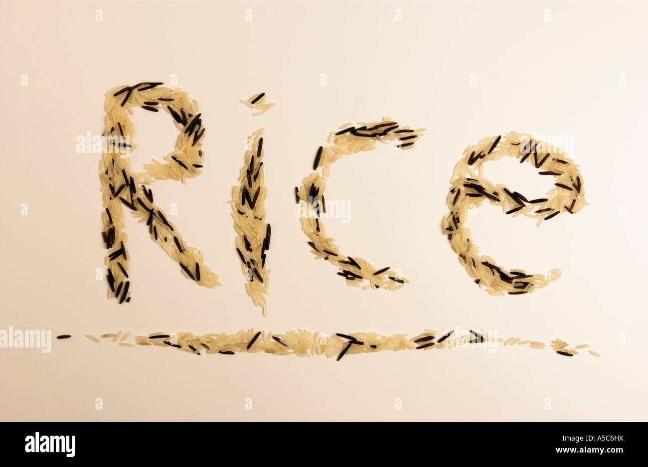 White and black Basmati rice forming word 'Rice' on white background ...