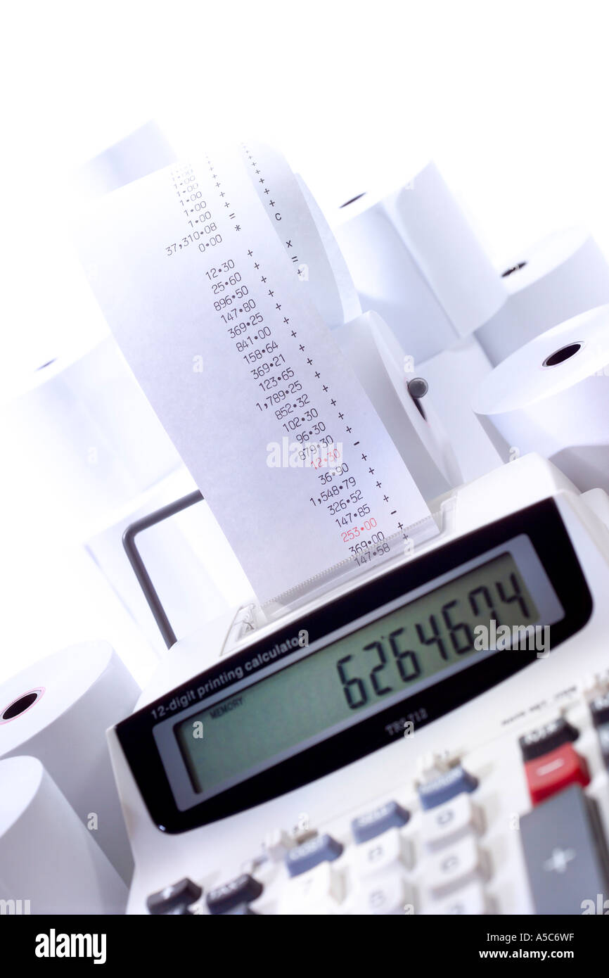 Desk calculator and addition rolls Stock Photo - Alamy