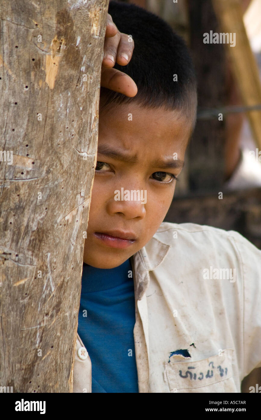 Cute Laotian Boy Standing next to a Tree near Udomxai or Muang Xai Laos ...