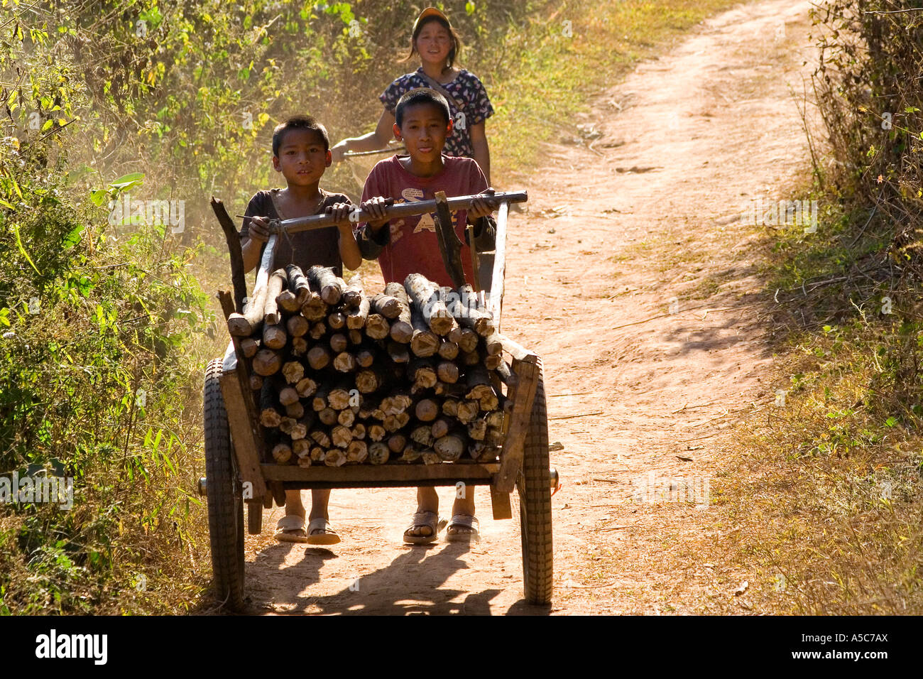 Boys pushing cart hi-res stock photography and images - Alamy