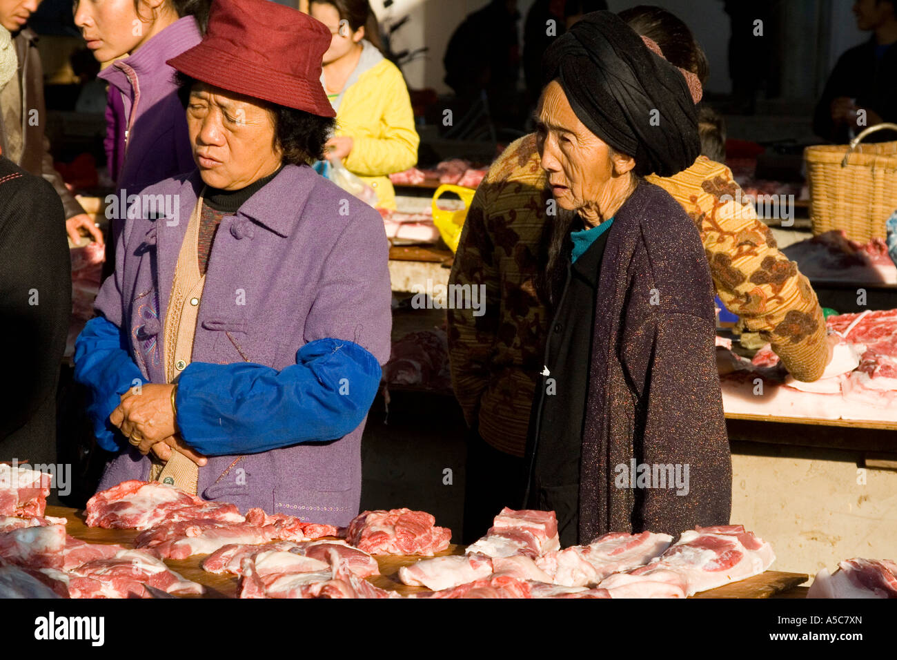 Yao Woman with Black Turban Buying Pork at Market Menghai China ...
