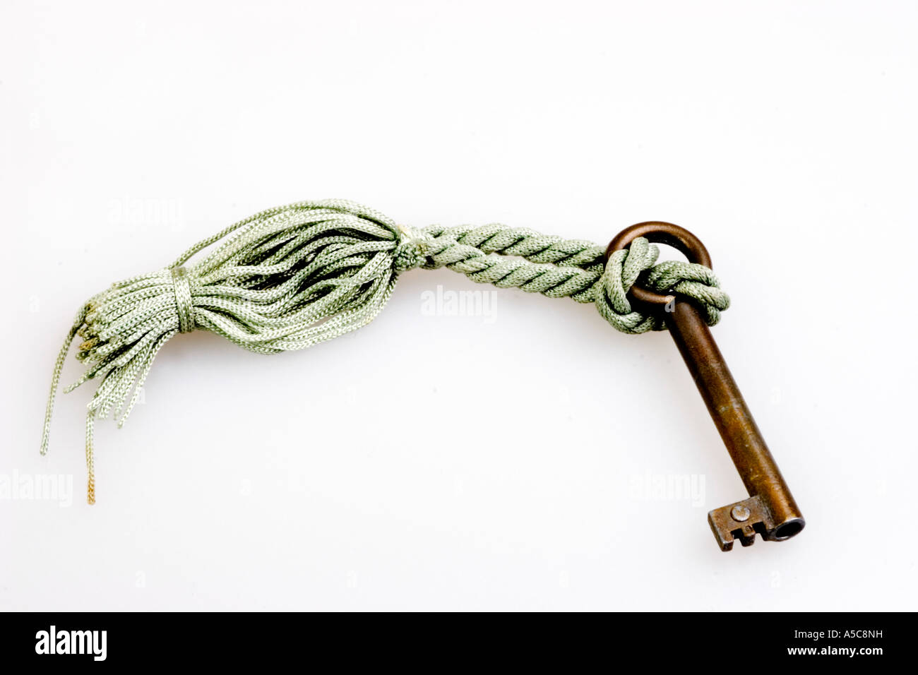 Old fashioned key with decorative fob Stock Photo - Alamy