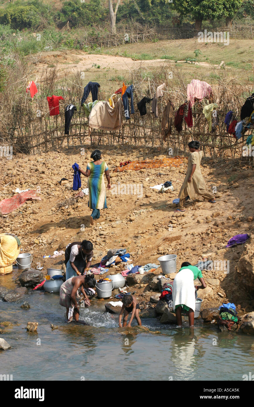 Indian village women washing clothes hi-res stock photography and ...
