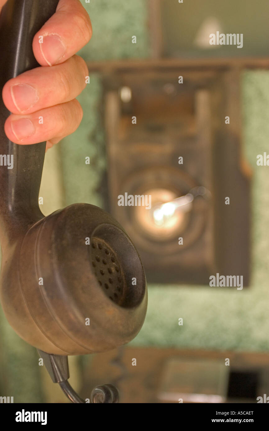 old phone hanging on the wall Stock Photo - Alamy