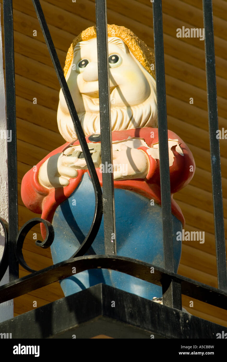 Smiling gnome in a balcony Stock Photo - Alamy
