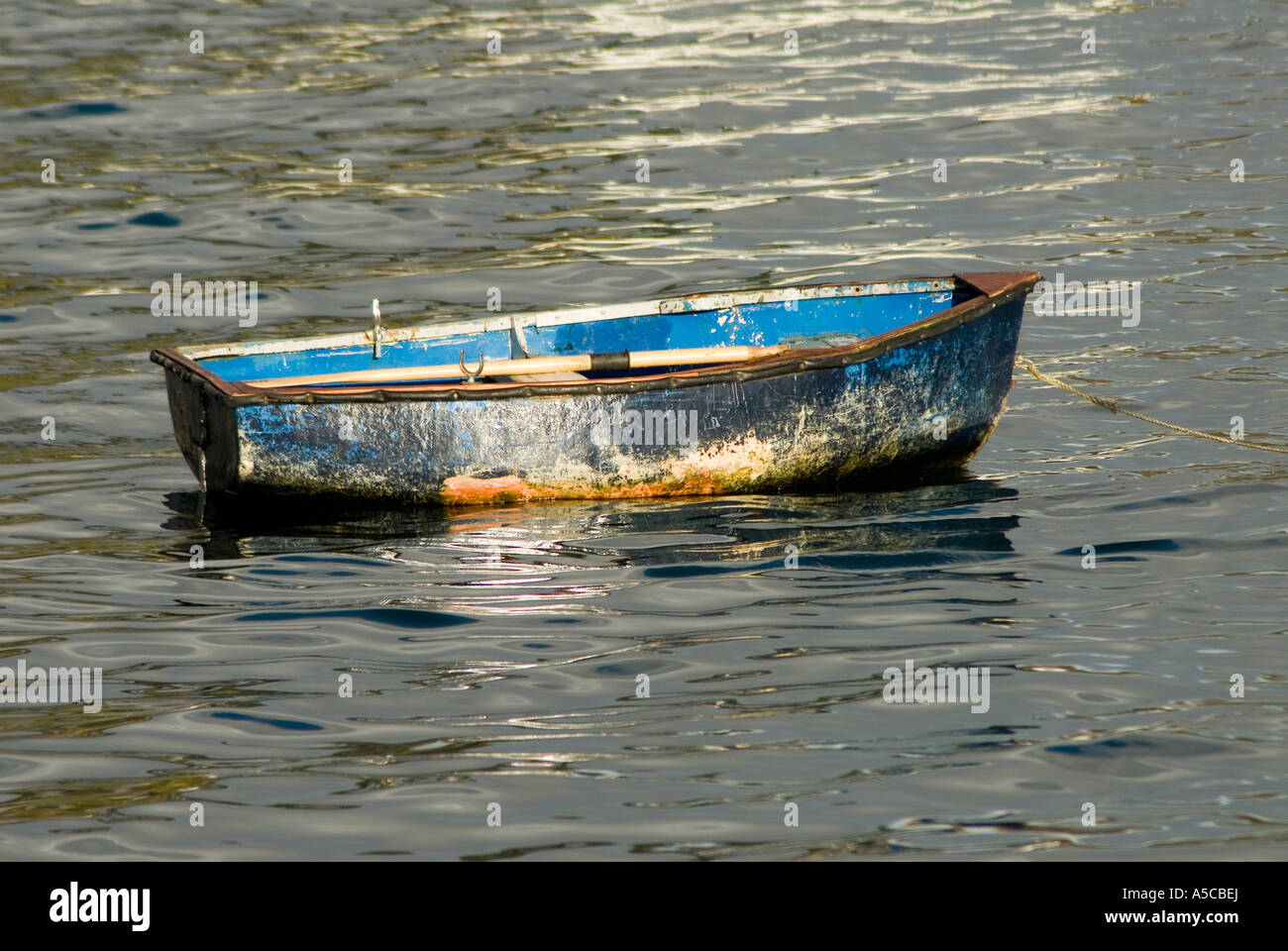 Small fishing boat floating in the sea Stock Photo - Alamy