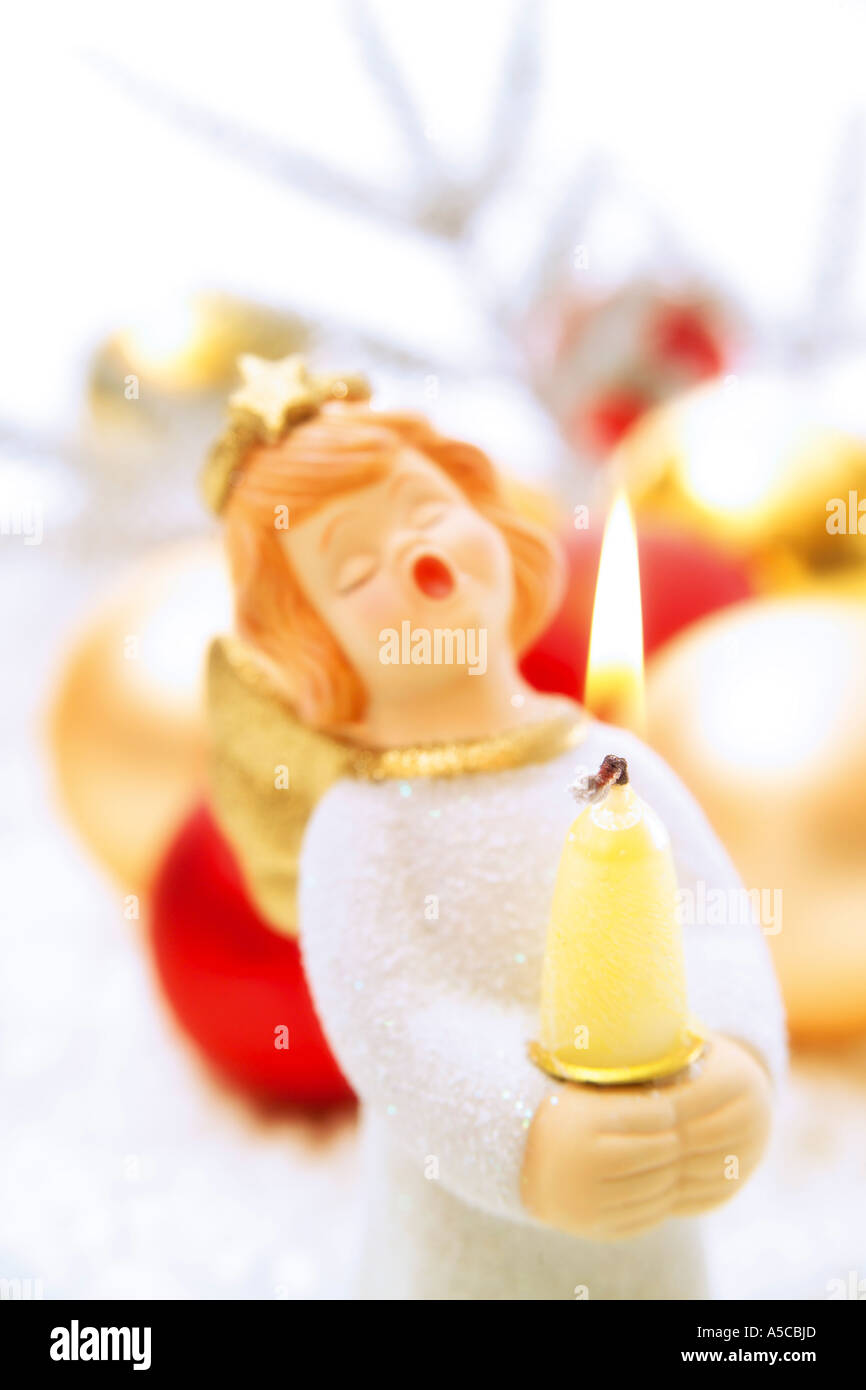 Angel statue holding candle Stock Photo - Alamy