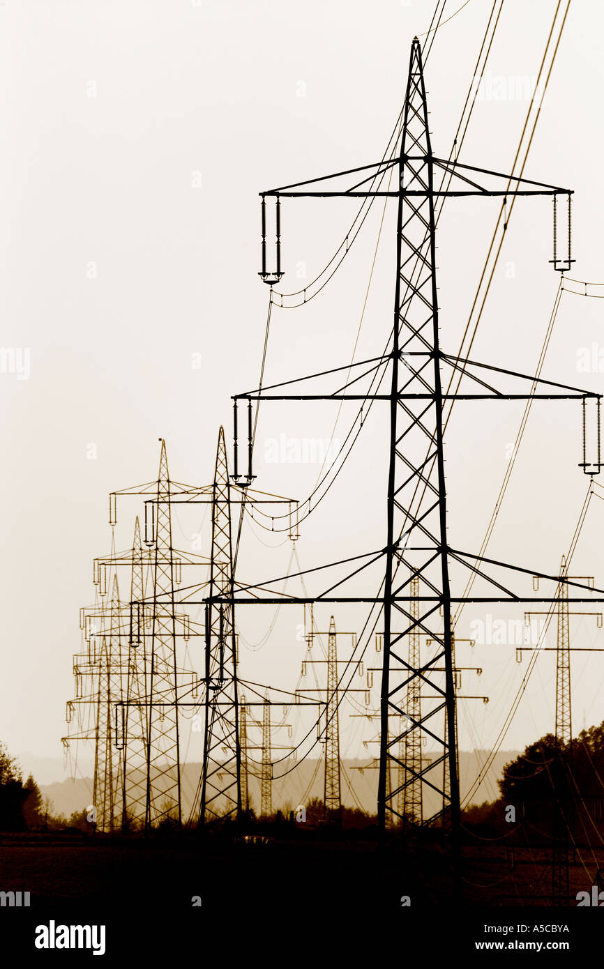 Electricity pylons and power lines, low angle view Stock Photo - Alamy