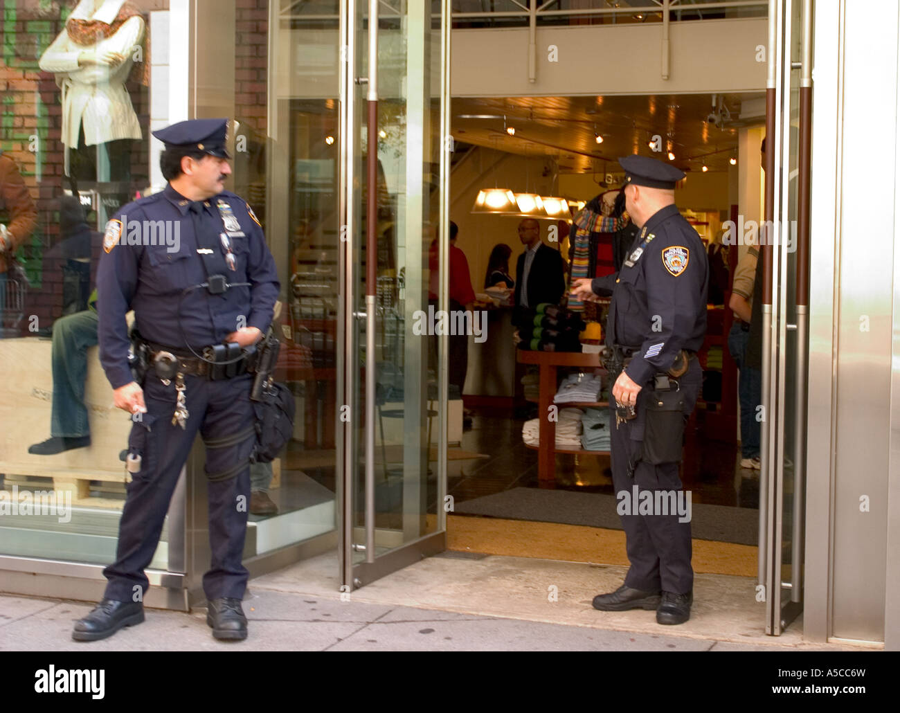 2 policemen outdoor of shop in street of new york usa Stock Photo - Alamy