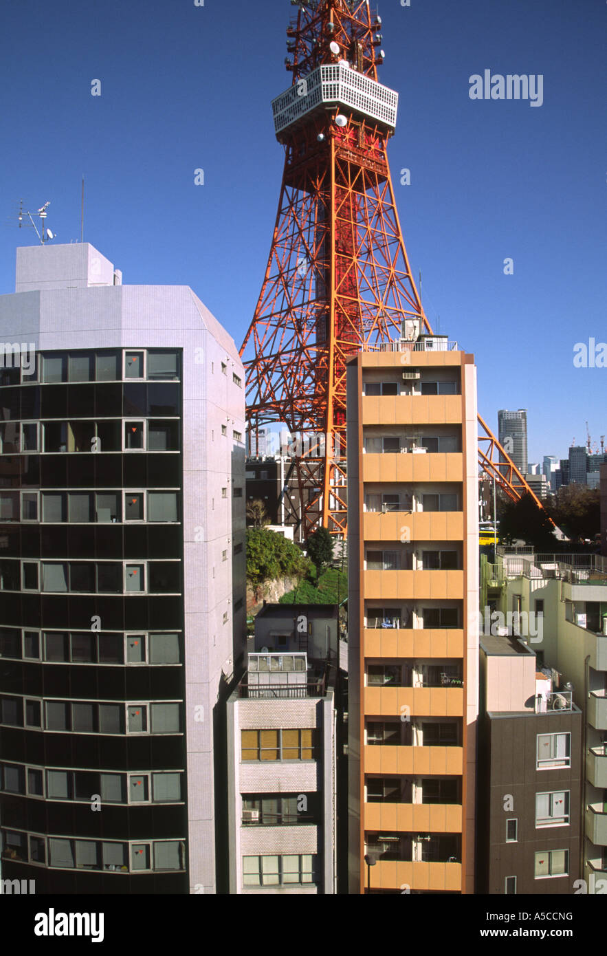Tokyo Tower behind apartment buildings in Tokyo, Japan Stock Photo - Alamy