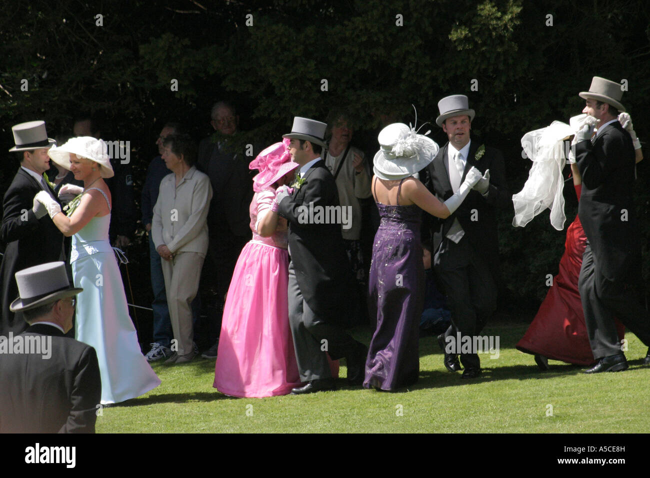 Elegantly dressed couples dance across the lawns during this Helston's ...