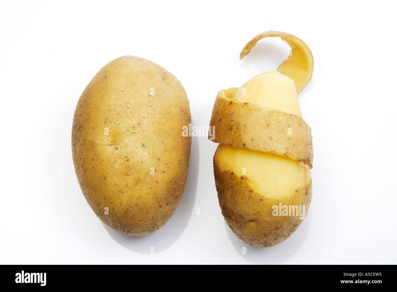 Peeled potato, elevated view Stock Photo - Alamy