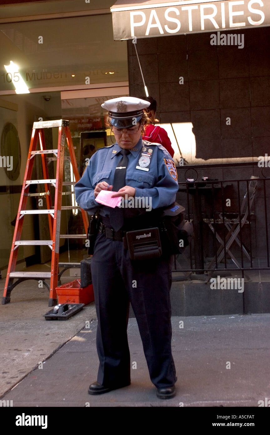 female cop getting a ticket in new york street Stock Photo - Alamy