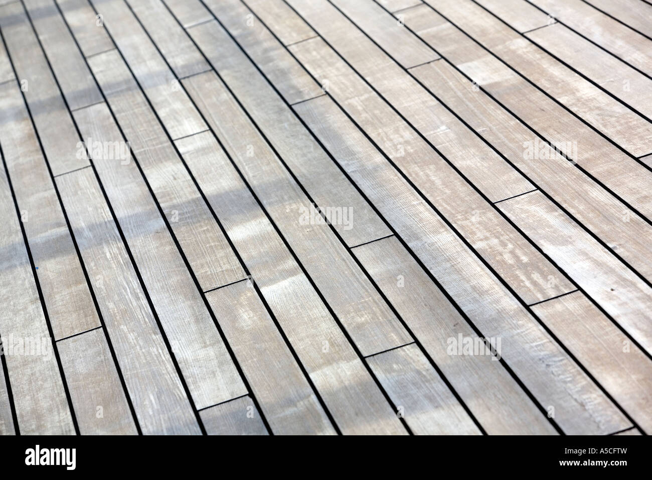 Cruise ship wood deck guard rail shadows Stock Photo - Alamy