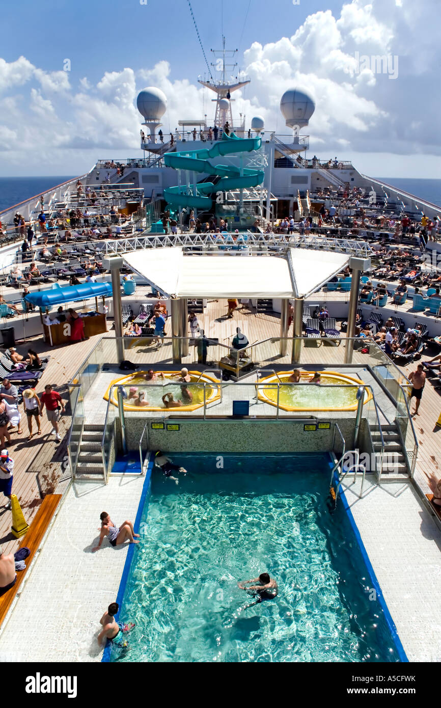 Crusie ship swim pool slide deck Stock Photo - Alamy