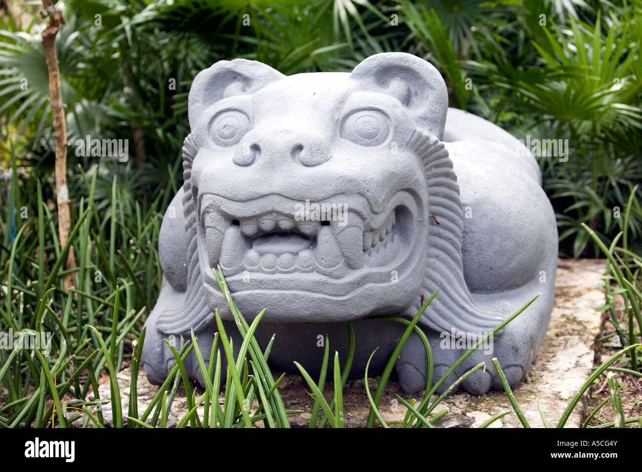 Maya statue lion Stock Photo - Alamy