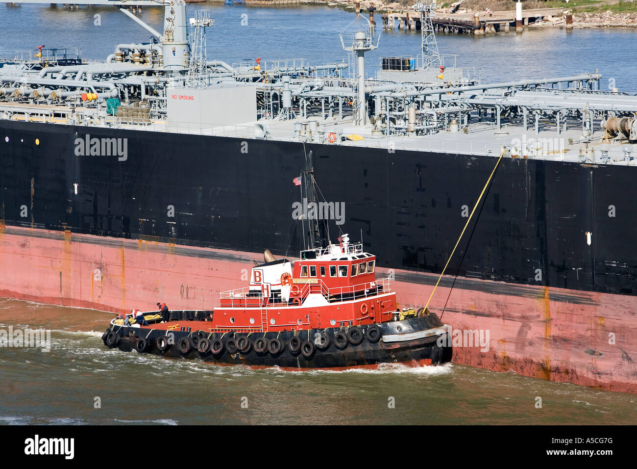 Oil tanker and tug boat Galveston Bay Stock Photo - Alamy