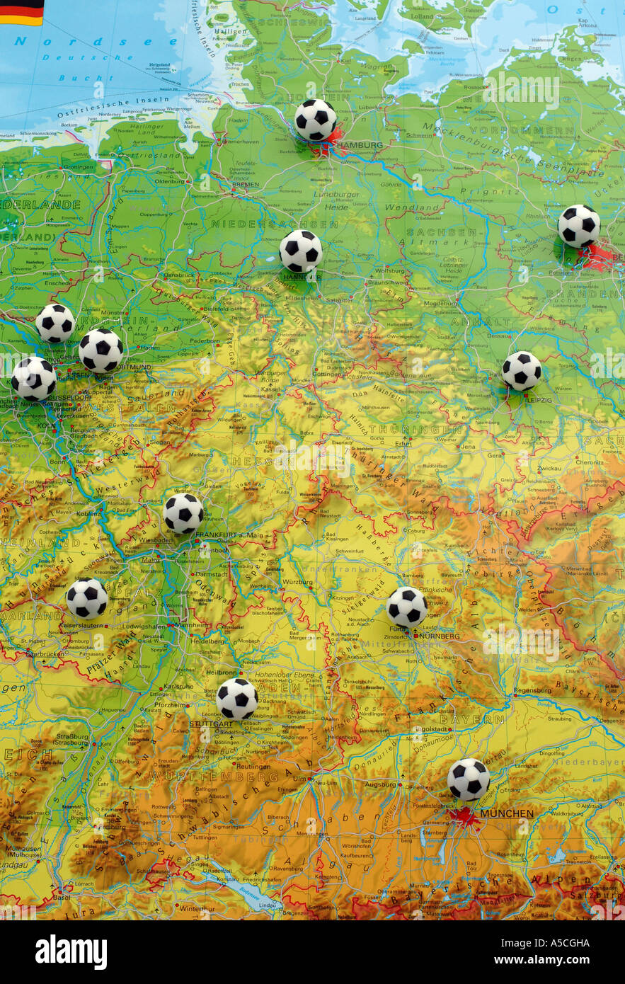 Soccer ball on map Stock Photo - Alamy