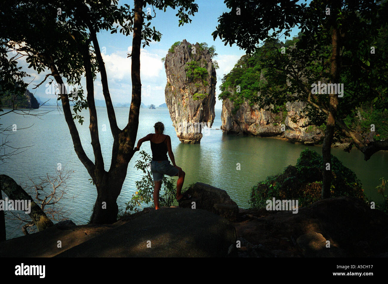 Female tourist looks out over Ko Khao Tapu or James Bond Island in ...